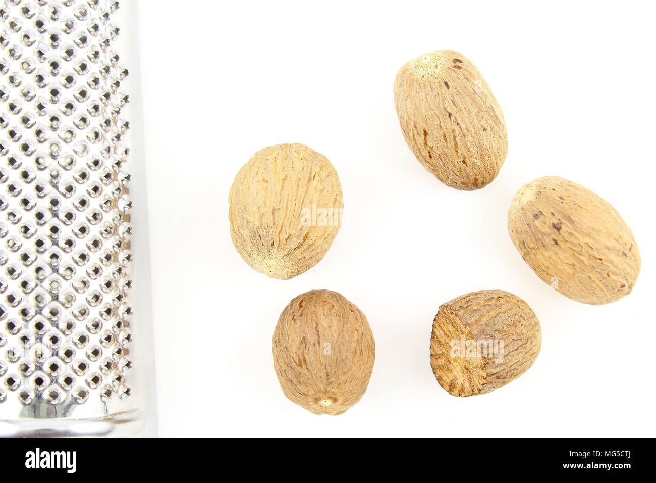 composition of nutmeg seeds isolated on a white background Stock Photo ...