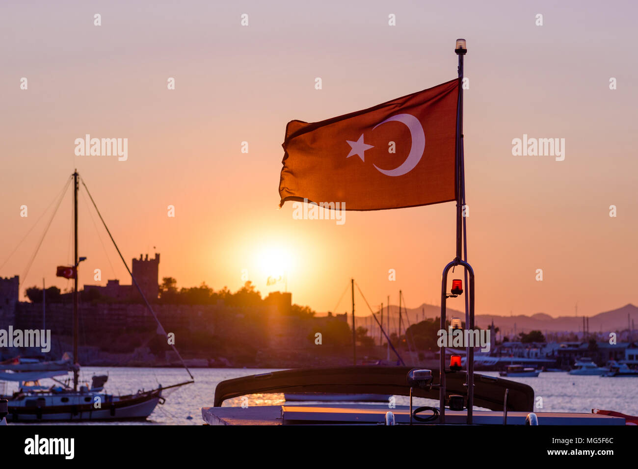 With Turkish flag on foreground,Sunset view of Bodrum Marine with ...