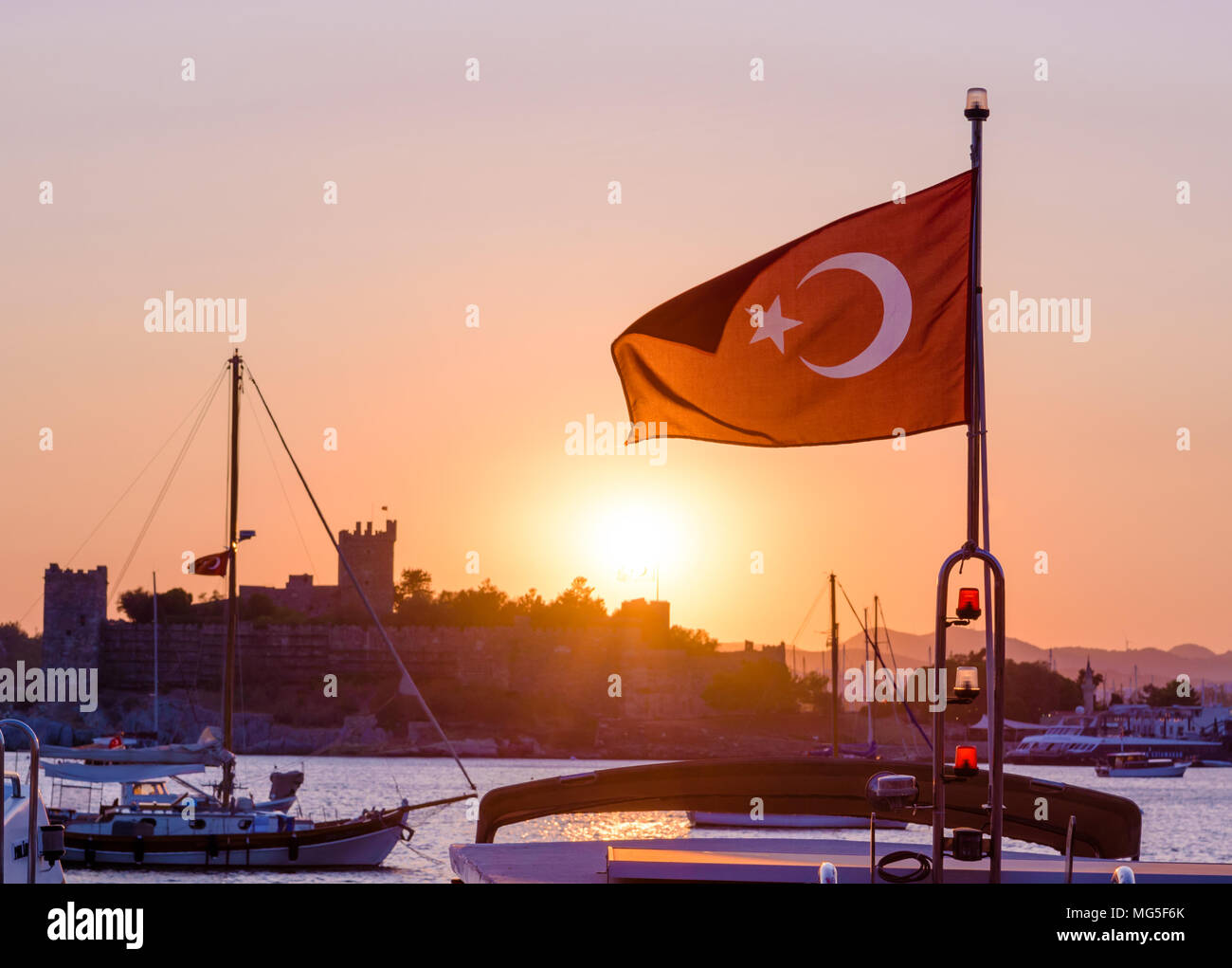 With Turkish flag on foreground,Sunset view of Bodrum Marine with ...