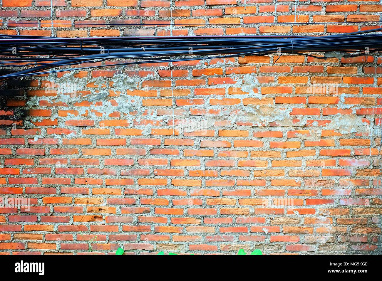 Messy Electrical Wires with Broken Old Brick Wall Stock Photo - Alamy
