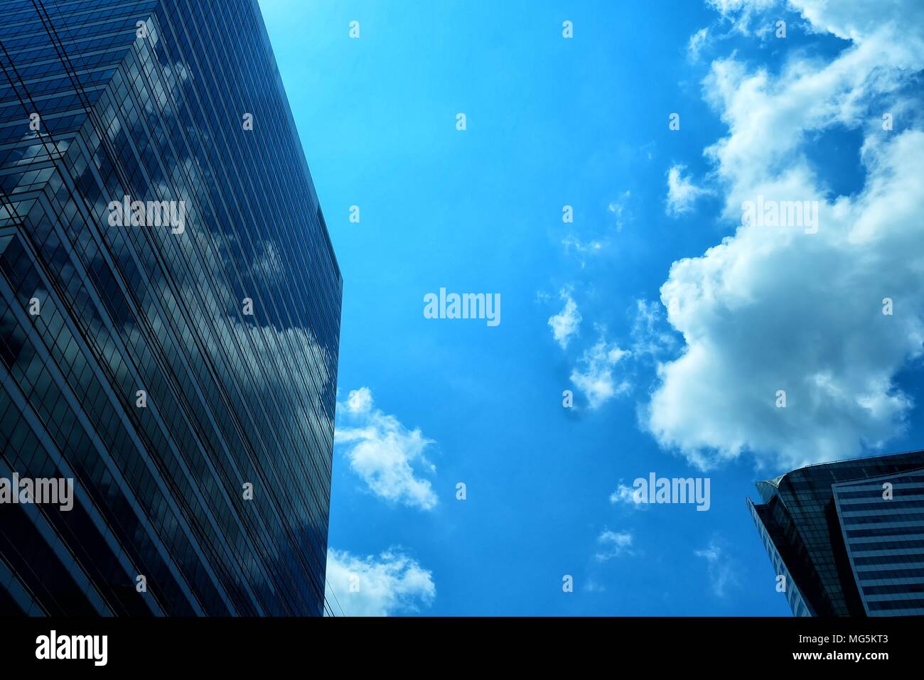 Modern Building with Clouds and Blue Sky Background Stock Photo - Alamy