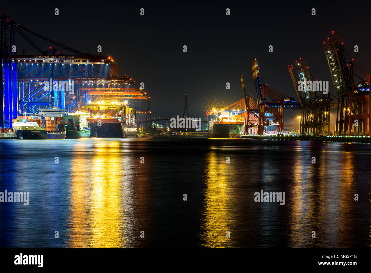 Container ship in the harbour at night. Container vessel at Terminal ...