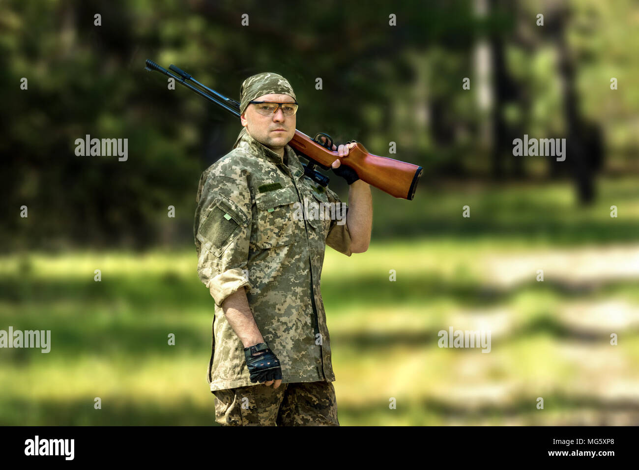 image of a young man with an air rifle Stock Photo - Alamy