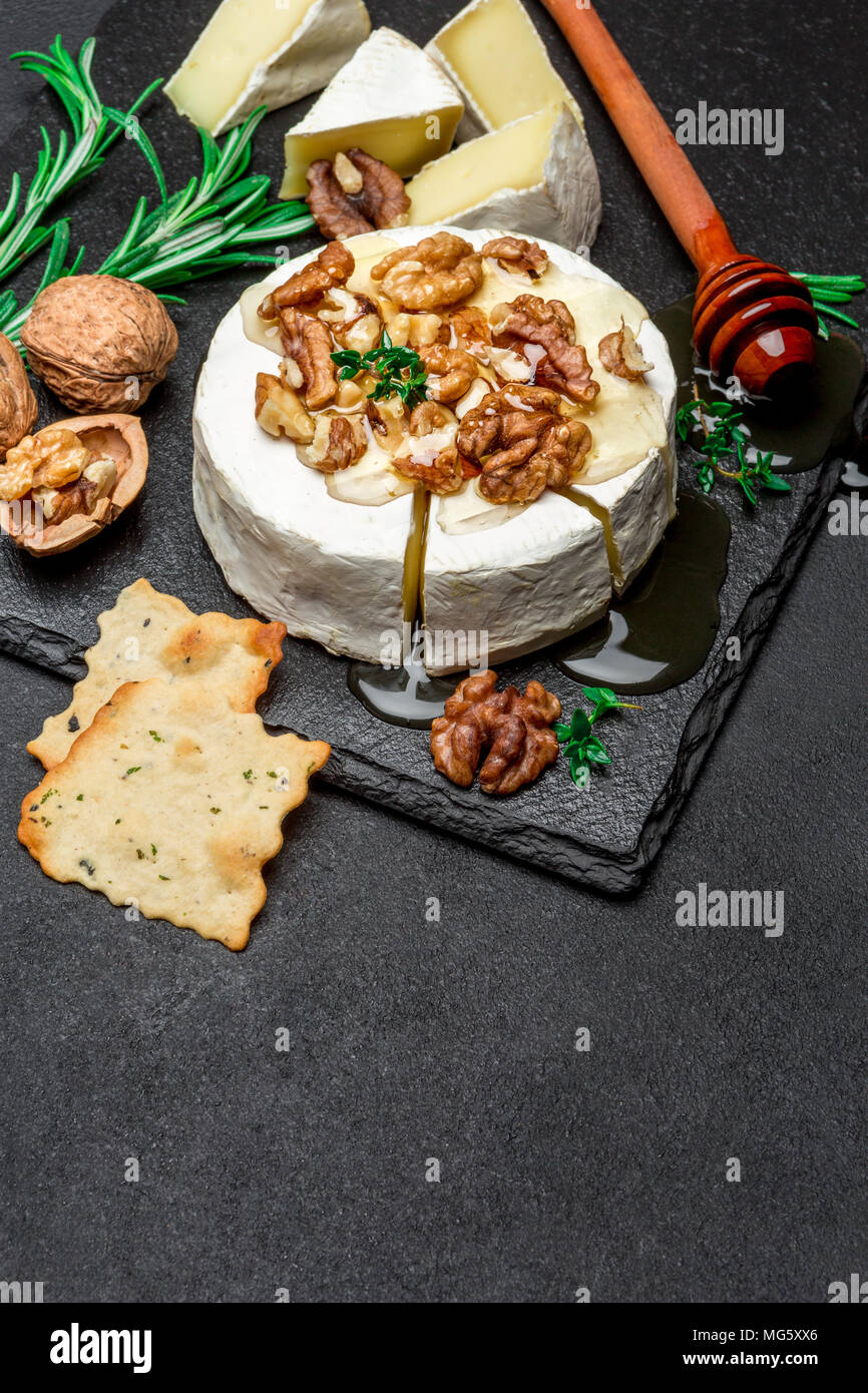 soft french camembert with bread on white kitchen paper Stock Photo - Alamy