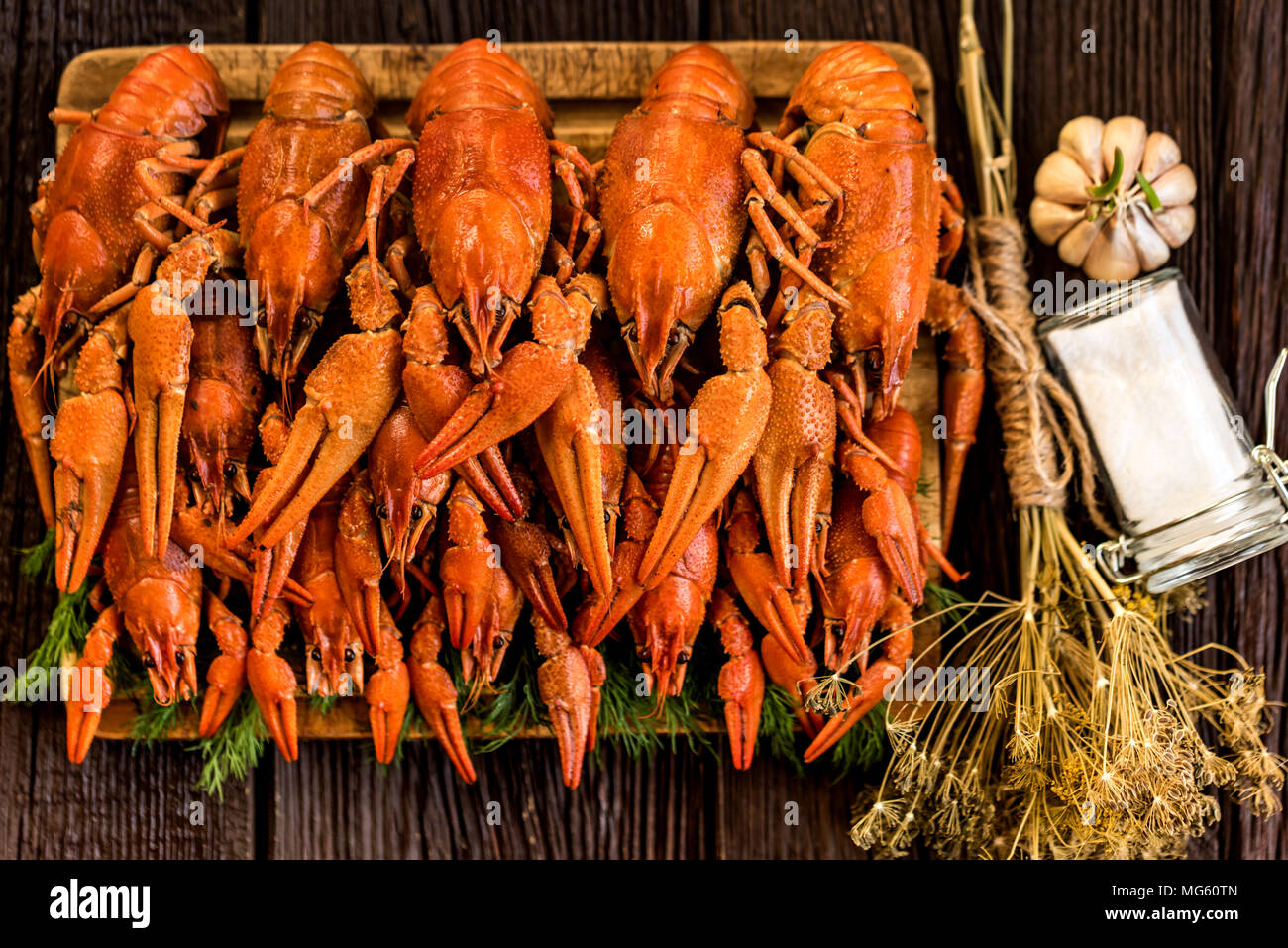 Boiled tasty crawfish with dill on rustic wooden background Stock Photo ...
