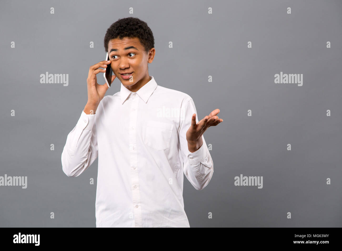 Happy positive man having a phone conversation Stock Photo - Alamy