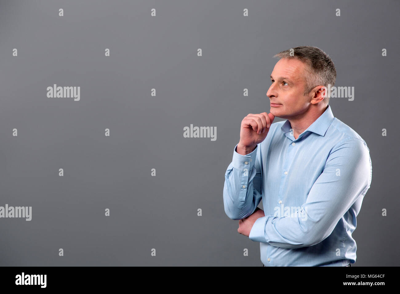 Smart nice man thinking Stock Photo - Alamy