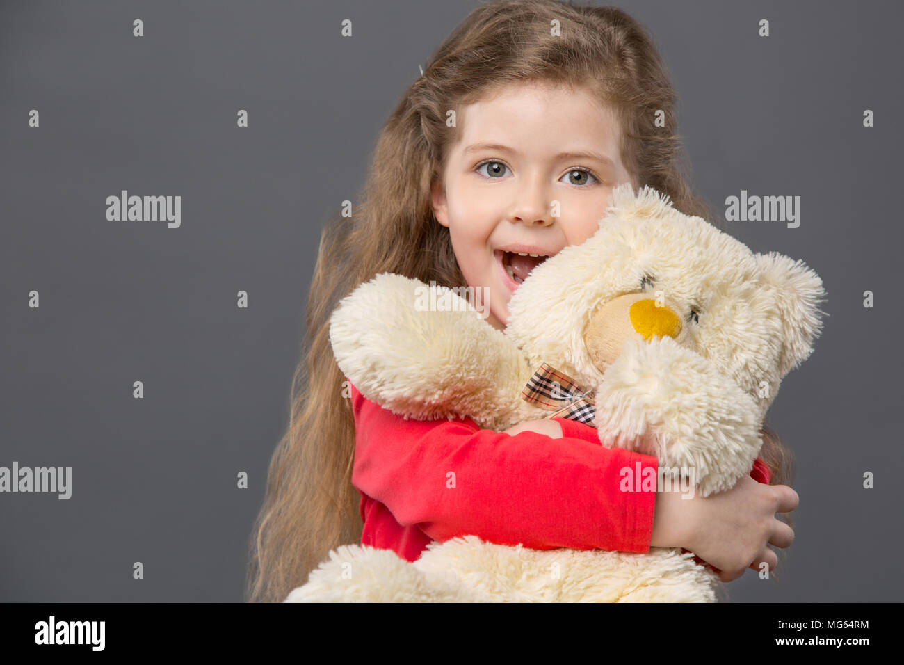 Happy delighted girl feeling excited Stock Photo - Alamy