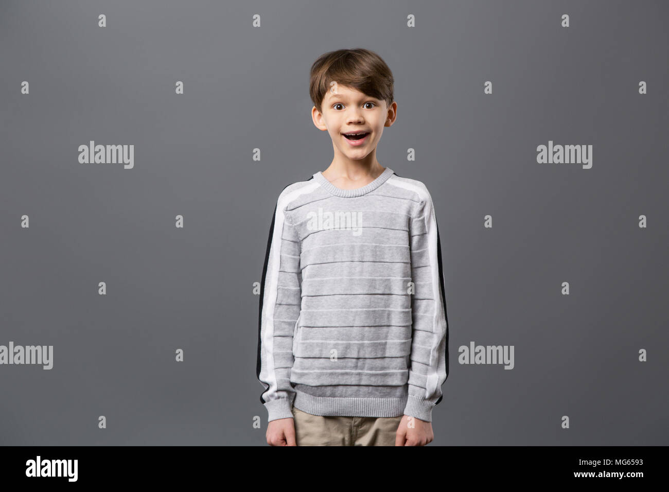 Happy excited boy looking at you Stock Photo - Alamy