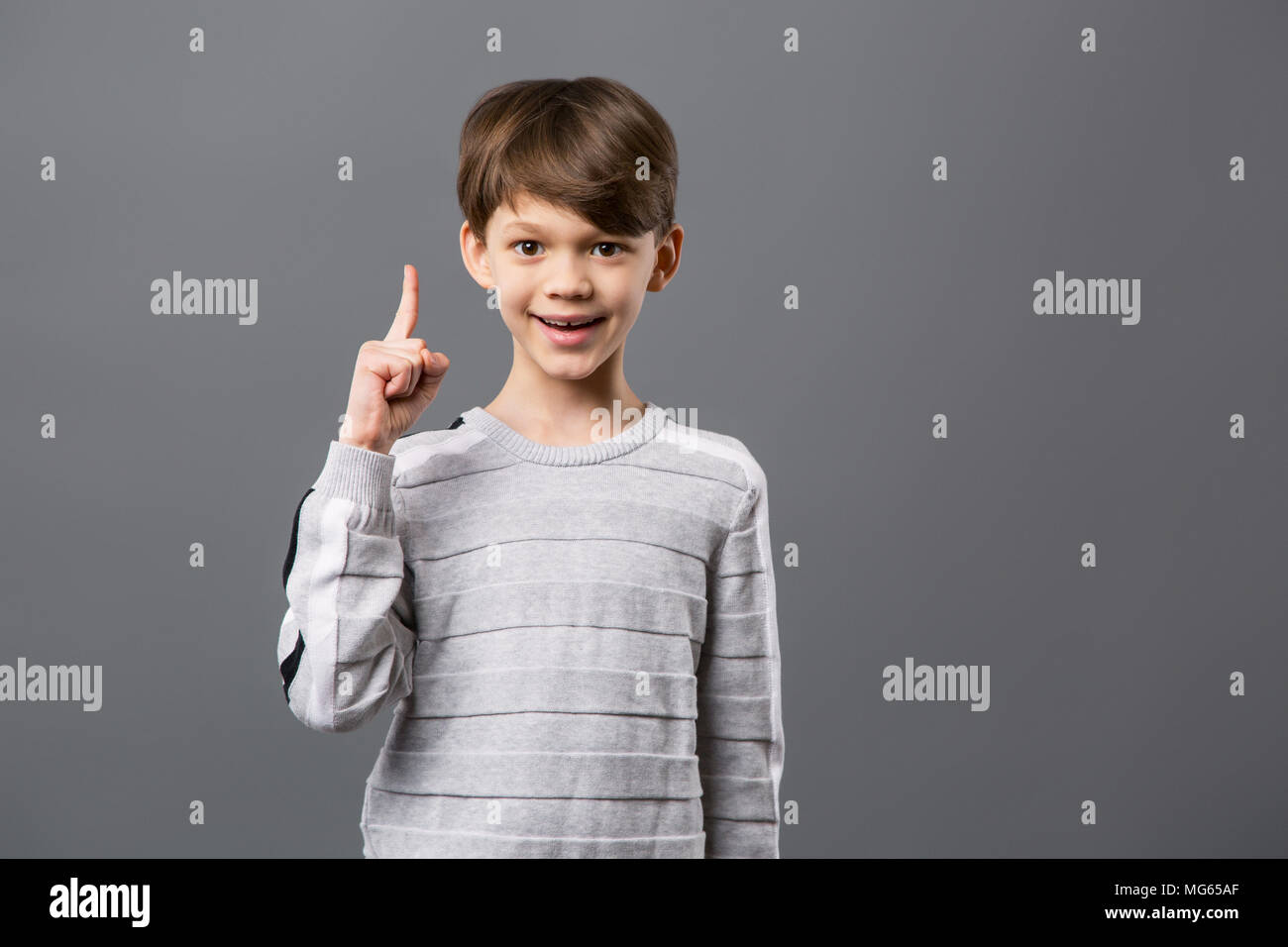 Nice intelligent boy having an idea Stock Photo - Alamy