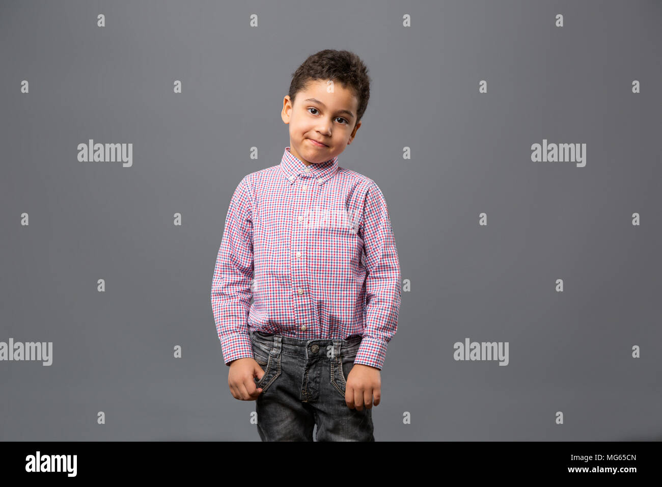 Nice pleasant boy looking at you Stock Photo - Alamy