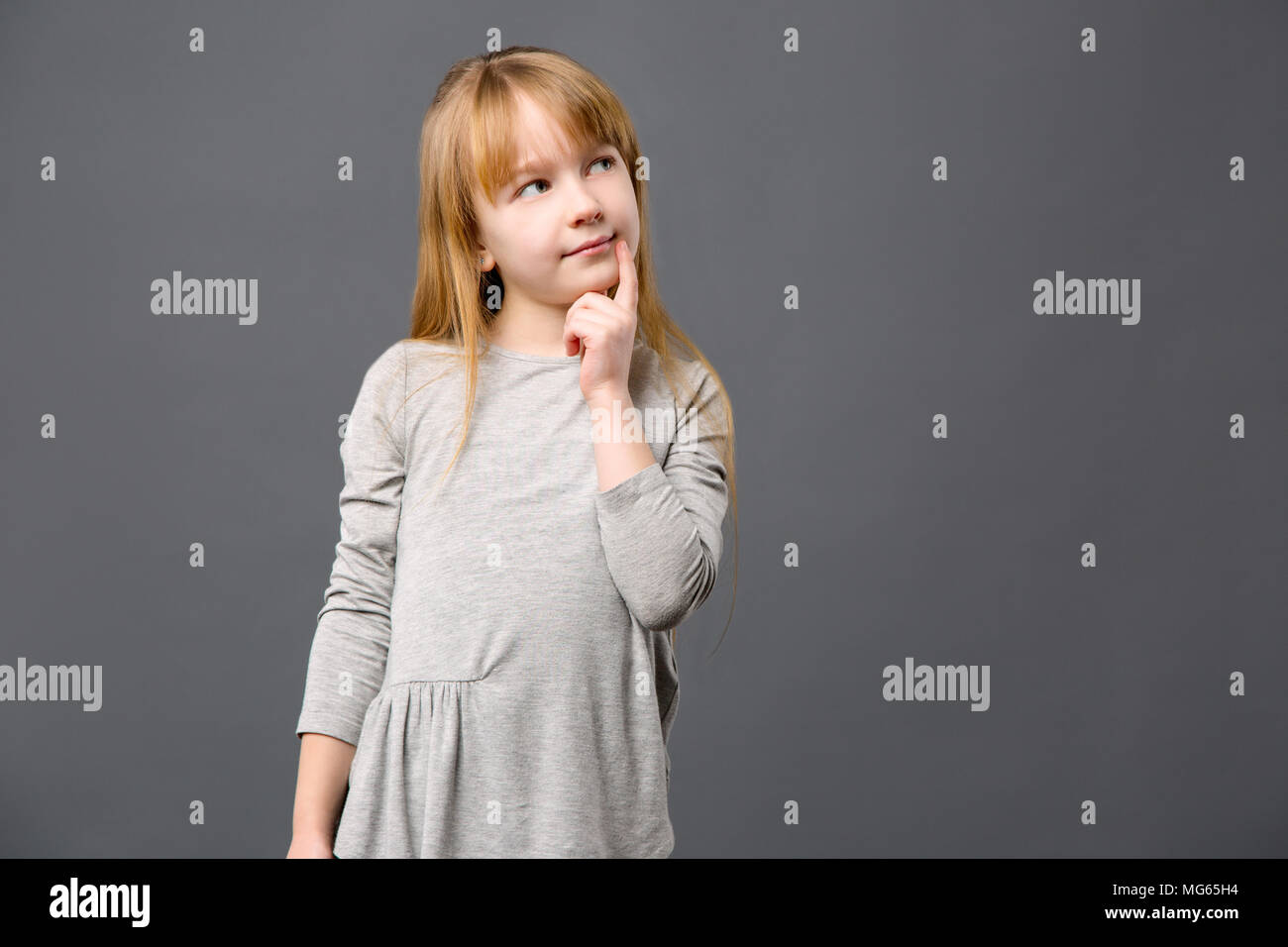 Nice smart girl thinking Stock Photo - Alamy