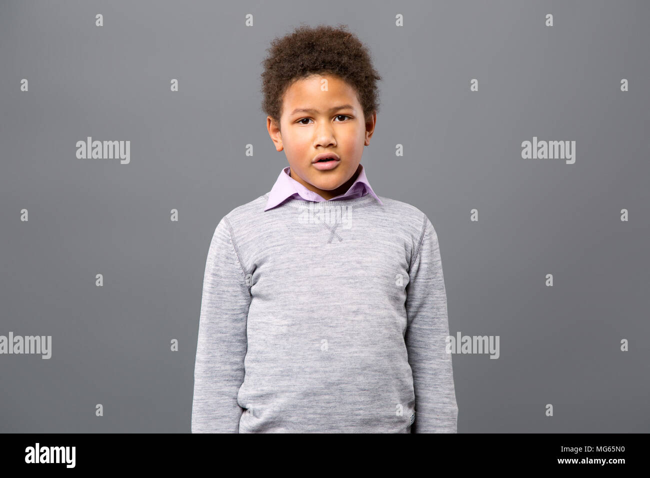 Nice pleasant boy looking at you Stock Photo - Alamy