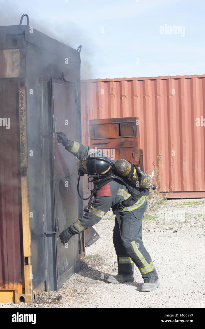 Firefighter putting out fire training station extinguisher backdraft ...