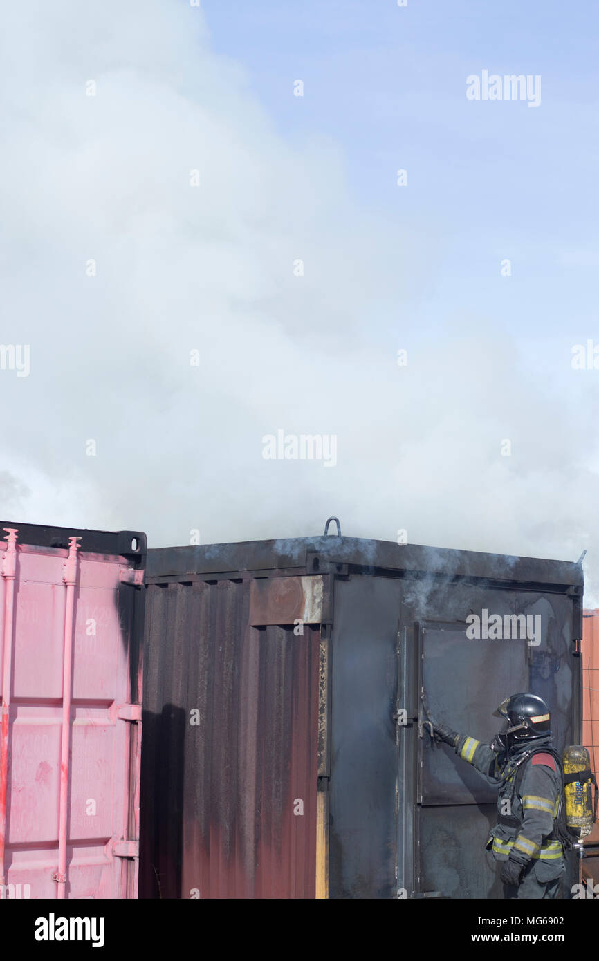 Firefighter putting out fire training station extinguisher backdraft ...