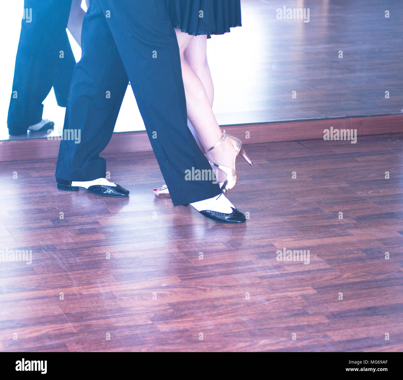 Ballroom dance couple of dancers and teachers in studio school dancing ...