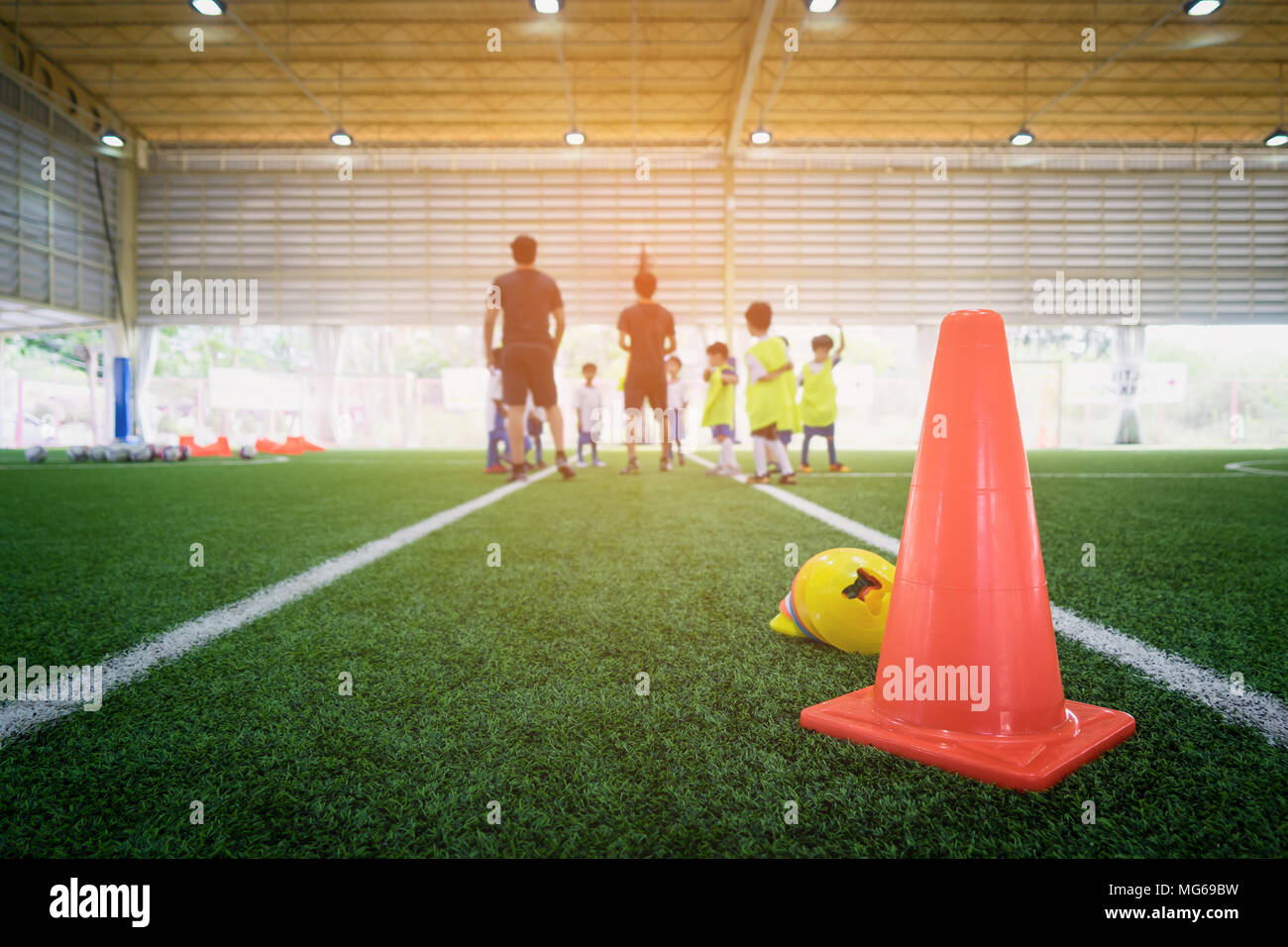 Soccer training equipments on training ground with children Stock Photo ...
