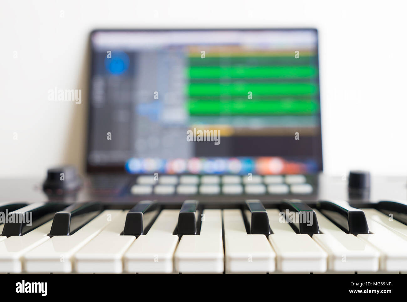 Working on Music Application with Music Keyboard Stock Photo - Alamy