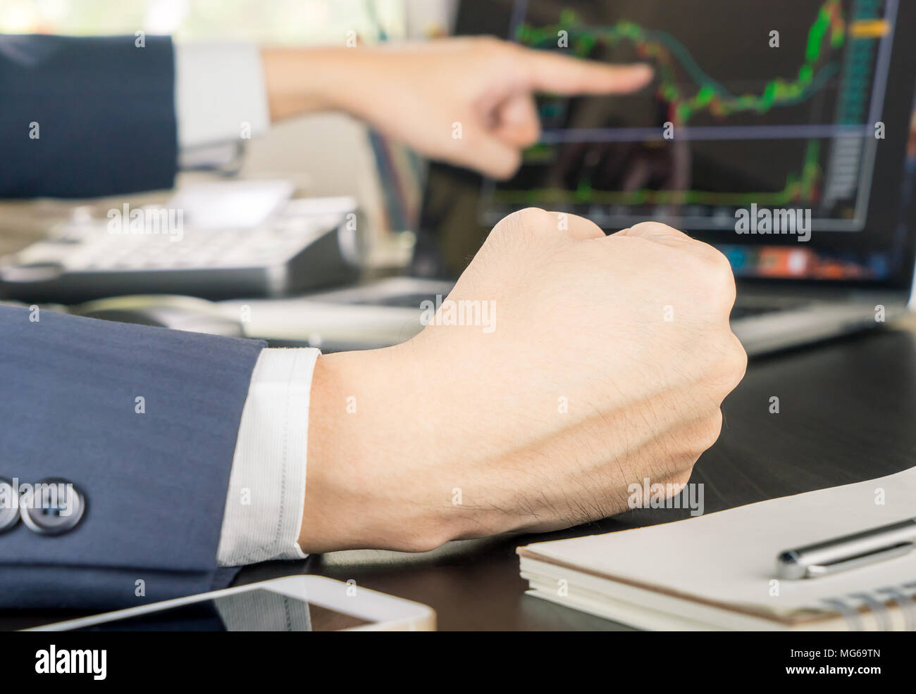 Stock trader is confidence about his stock on screen Stock Photo - Alamy