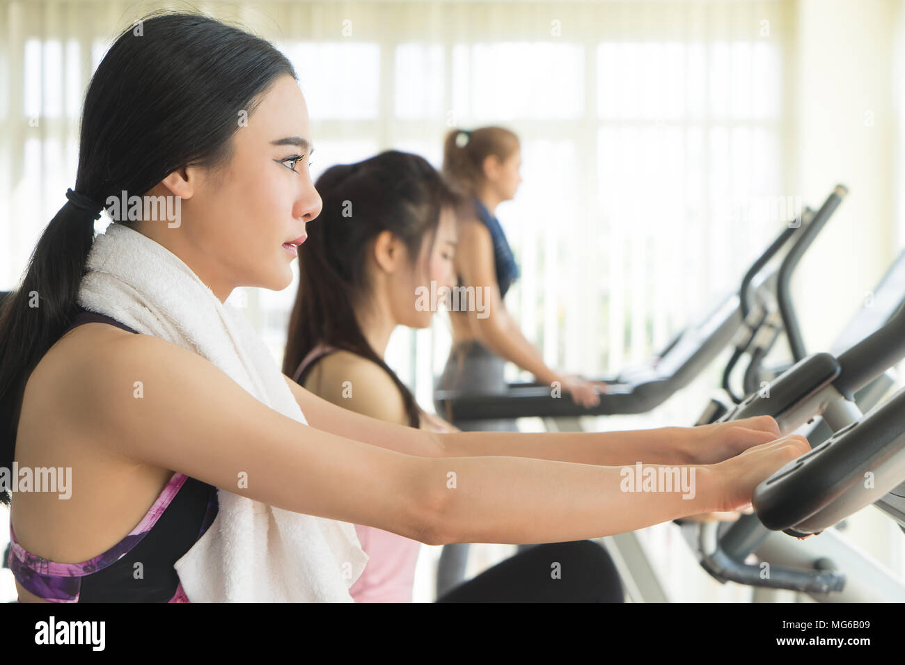 Chinese woman is working out in fitness gym Stock Photo - Alamy