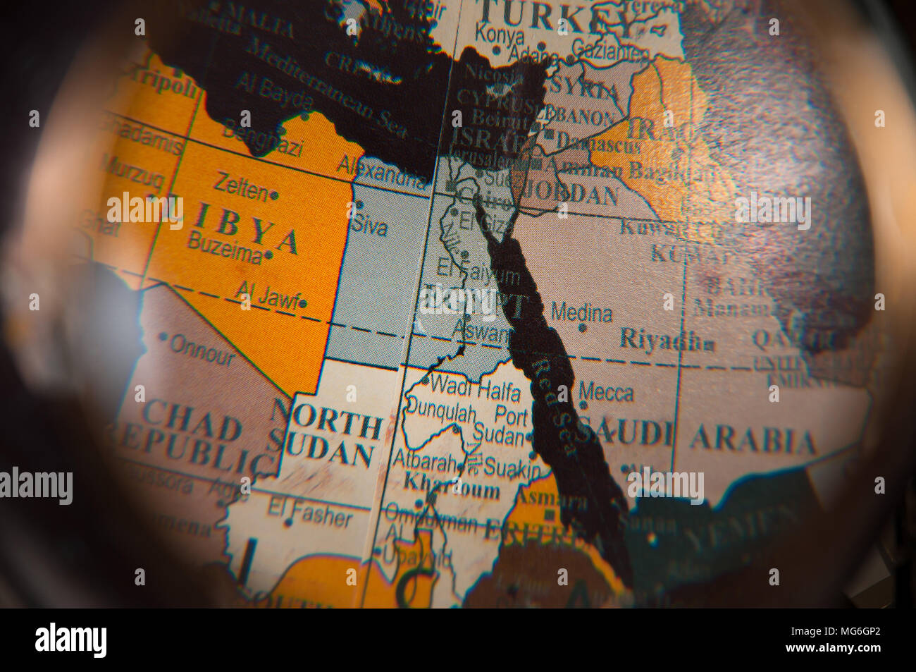 Focus on Egypt world map under magnifying glass Stock Photo - Alamy
