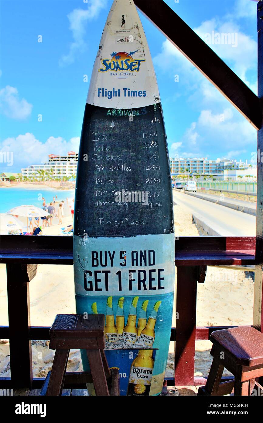 The famous surfboard at the Sunset Bar and Grill informing of the ...