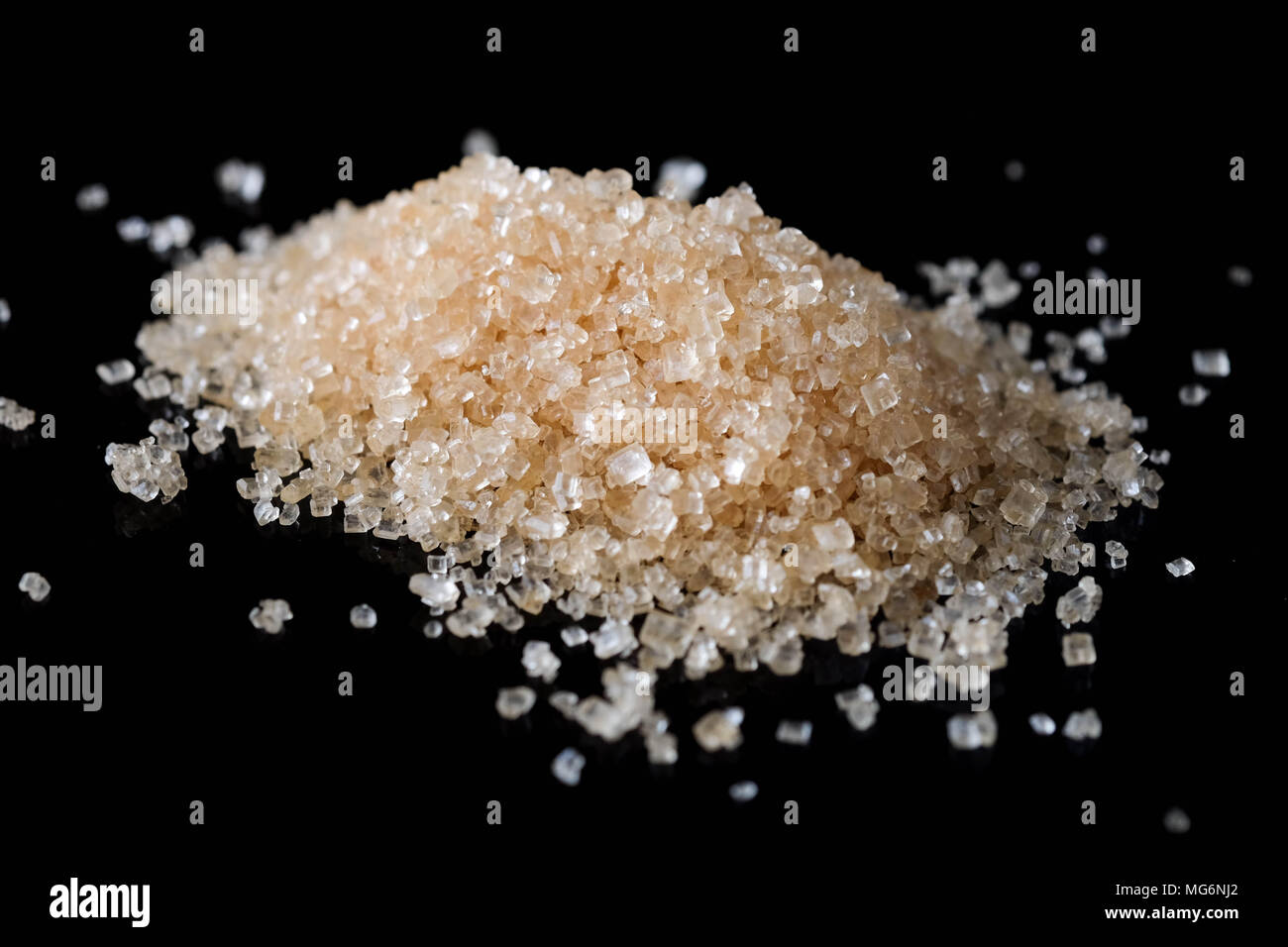Crystals Sugar,Brown cane sugar isolated on black background Stock ...