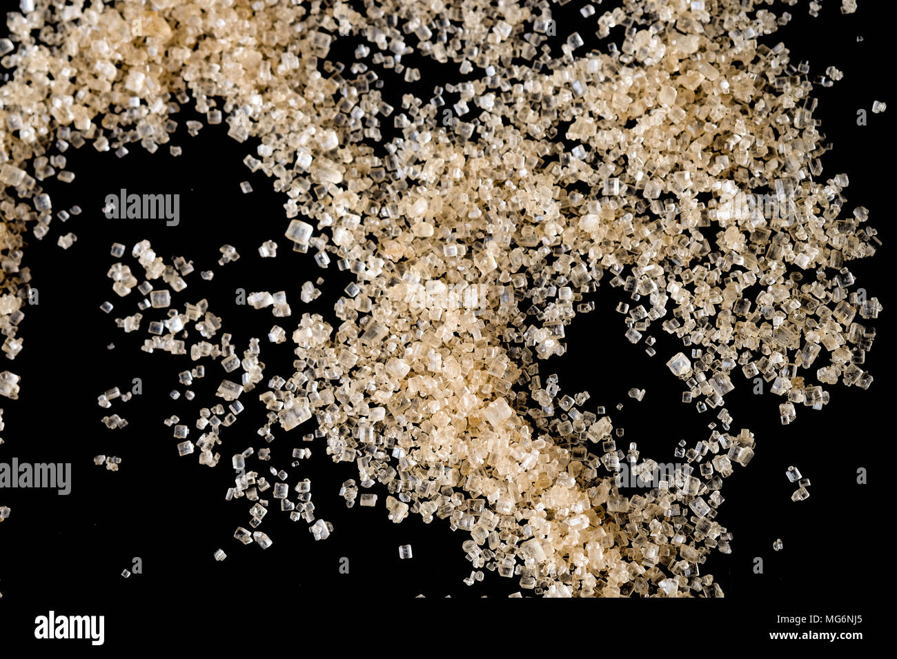 Crystals Sugar,Brown cane sugar isolated on black background Stock ...