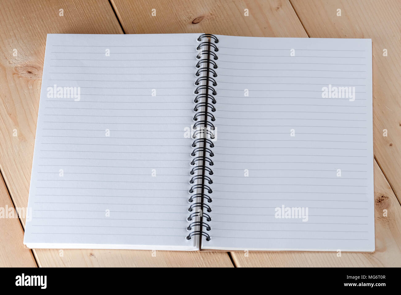 Recycled paper book on wooden background Stock Photo - Alamy