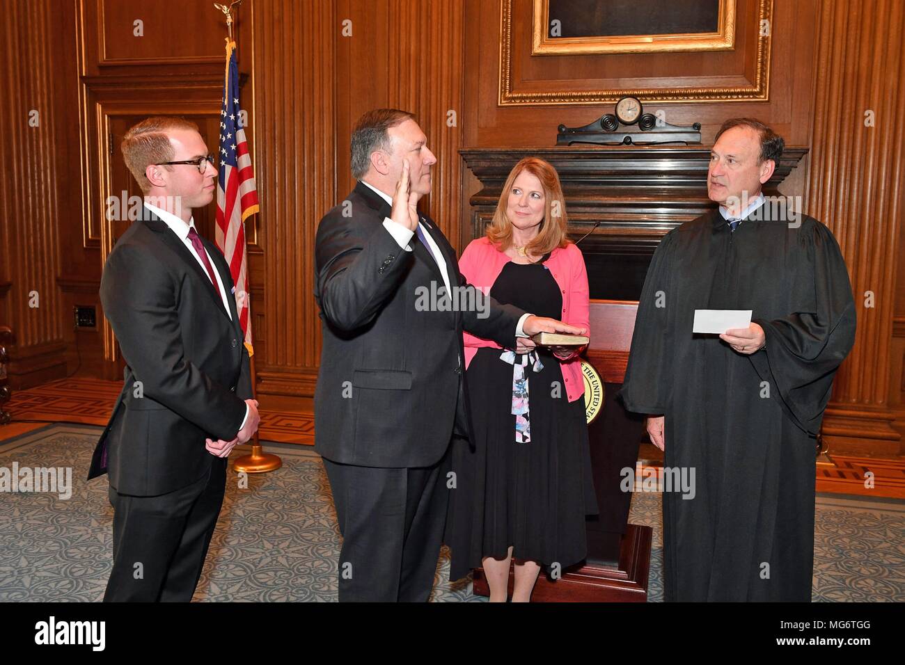 U.S. Secretary of State Mike Pompeo, center, takes the oath of office ...