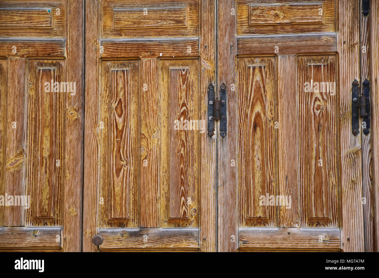 An old wooden vintage door of a historic building Stock Photo - Alamy