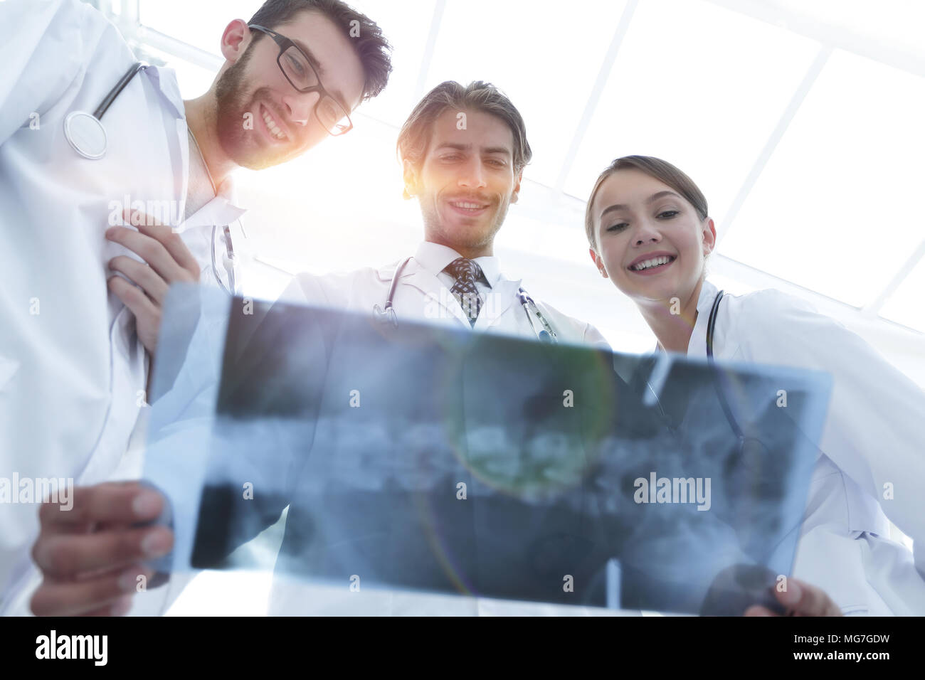bottom view young group of doctors looking at x-ray Stock Photo - Alamy