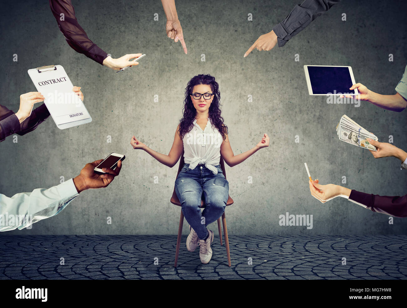Young business woman is meditating to relieve stress of busy corporate ...