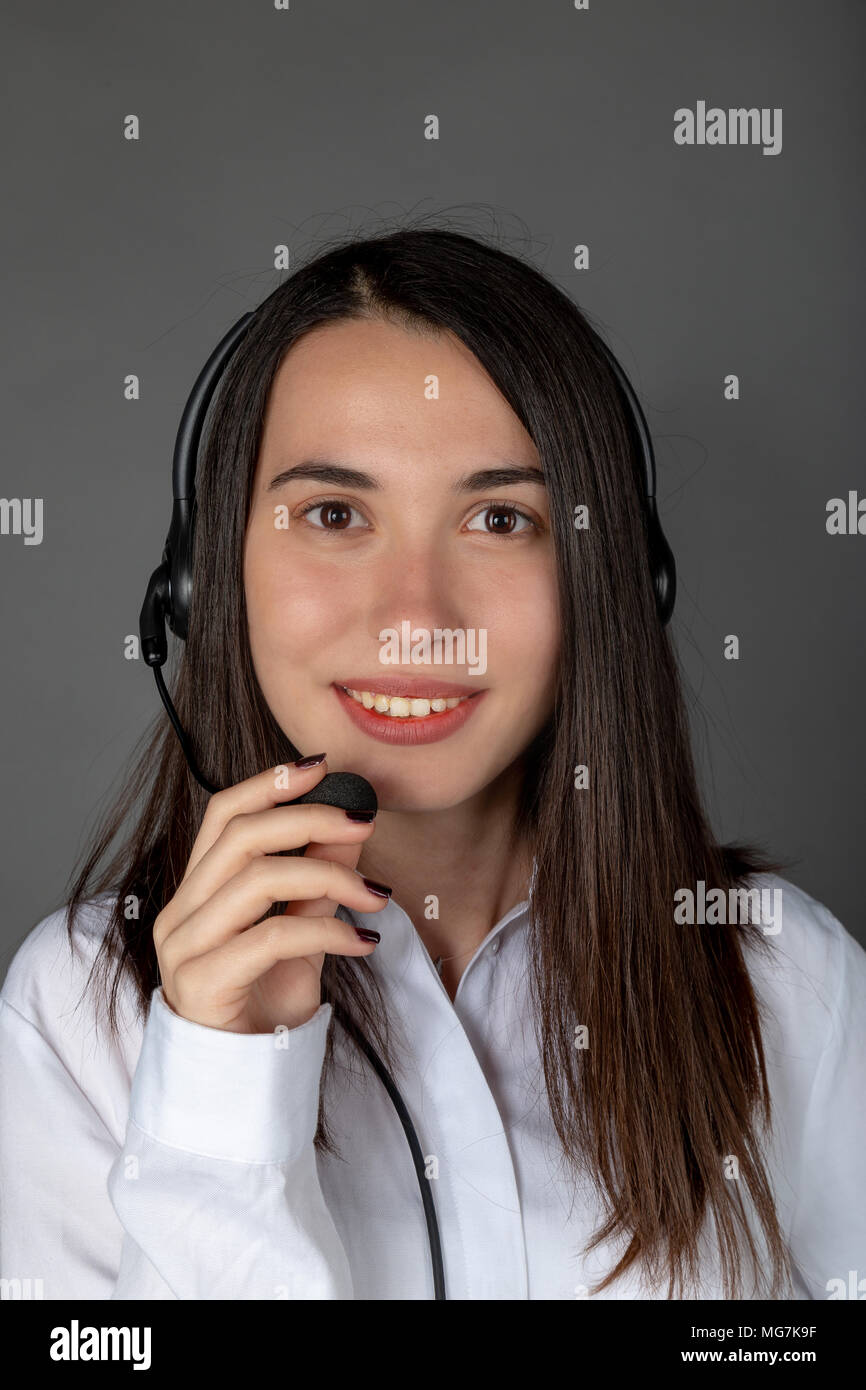 Beautiful smiling Turkish female call center girl on the job Stock ...