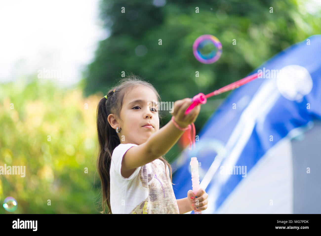 Girl blowing bubbles in water hi-res stock photography and images - Alamy