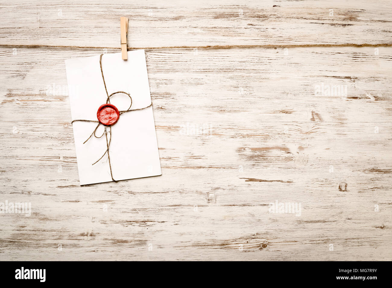 Mail envelope on rope Stock Photo - Alamy