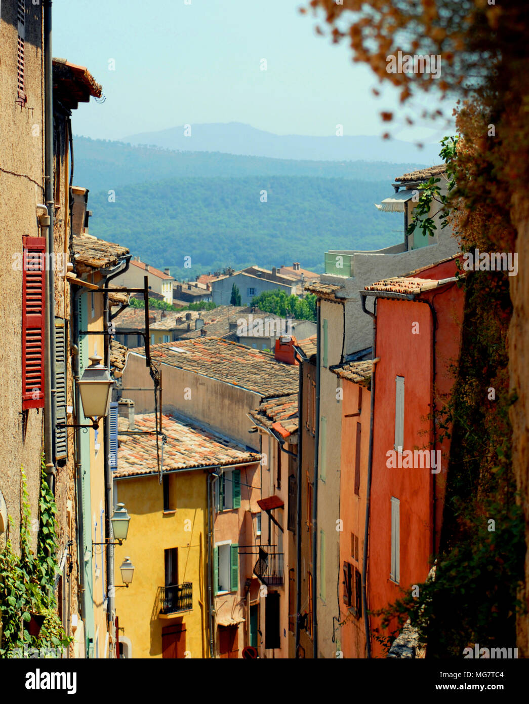 France- A colorful Cannes hillside street with distant view Stock Photo ...