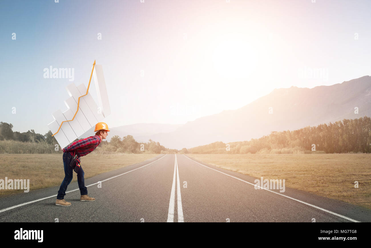 Engineer man carry progress graph Stock Photo - Alamy