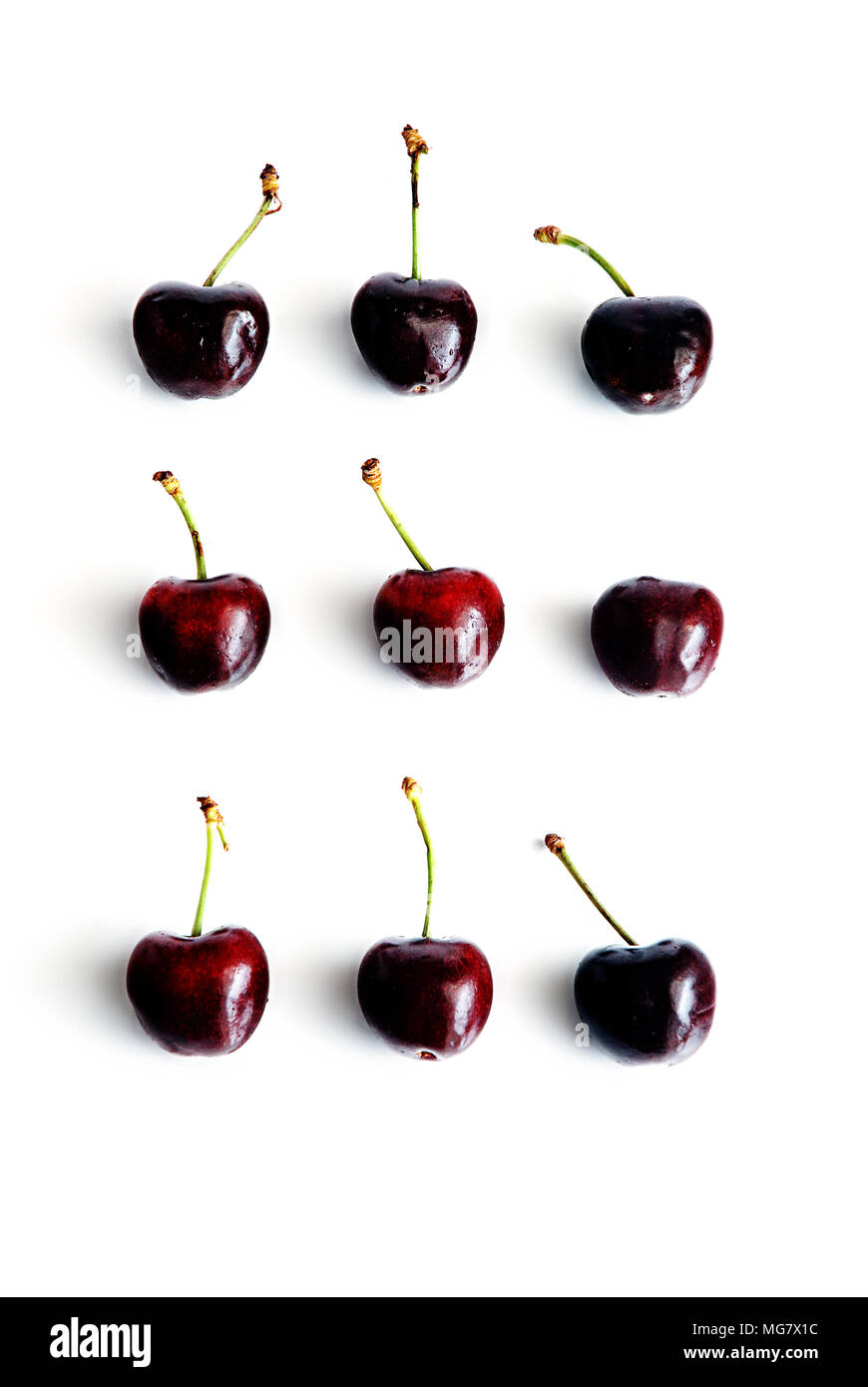 nine cherries - isolated on white Stock Photo - Alamy