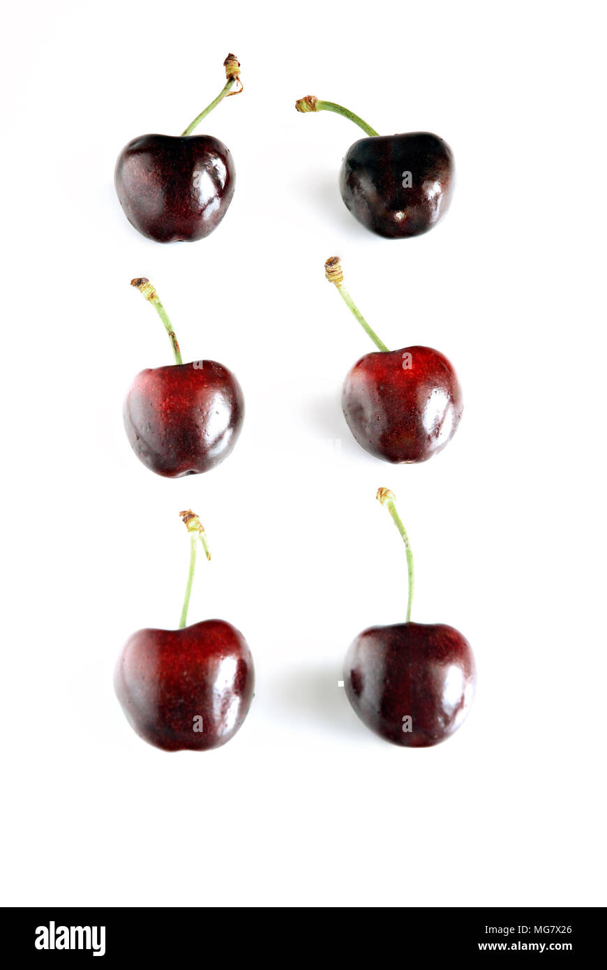 six cherries - isolated on white Stock Photo - Alamy