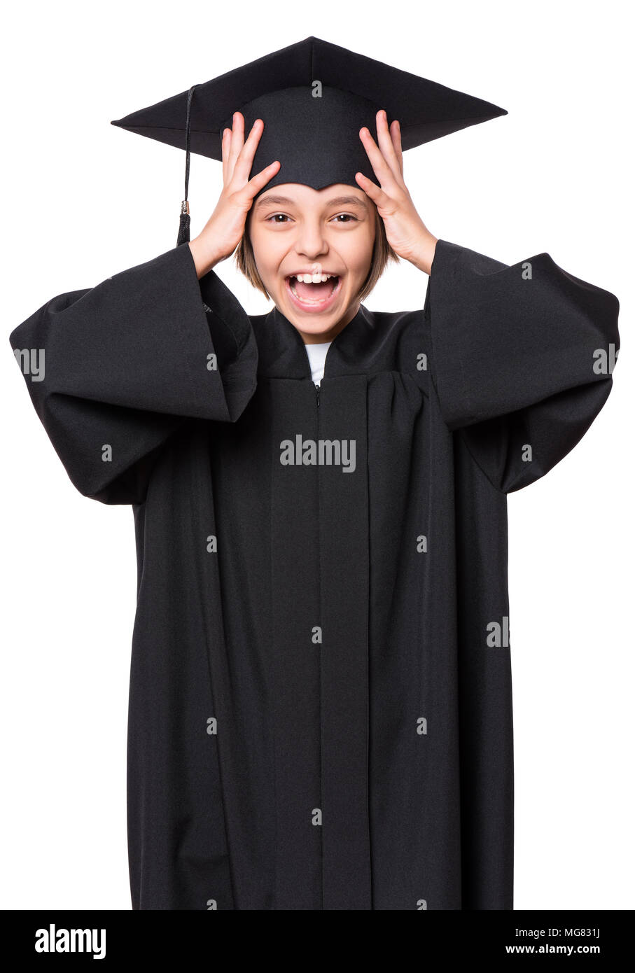 Portrait of graduate little girl student in black graduation gown with ...