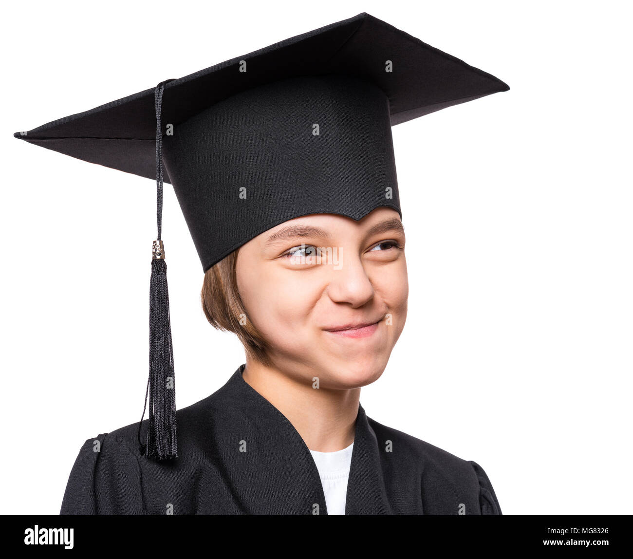 Portrait of graduate little girl student in black graduation gown with ...