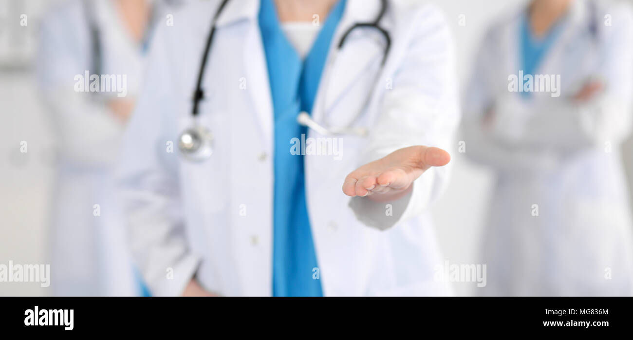 Group of medicine doctors offering helping hand for shaking hand or ...