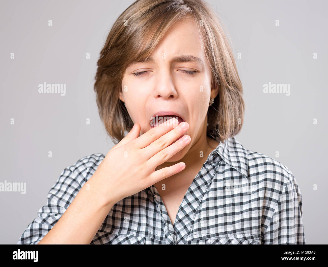 Beautiful caucasian teen girl on gray background. Funny cute teenager ...