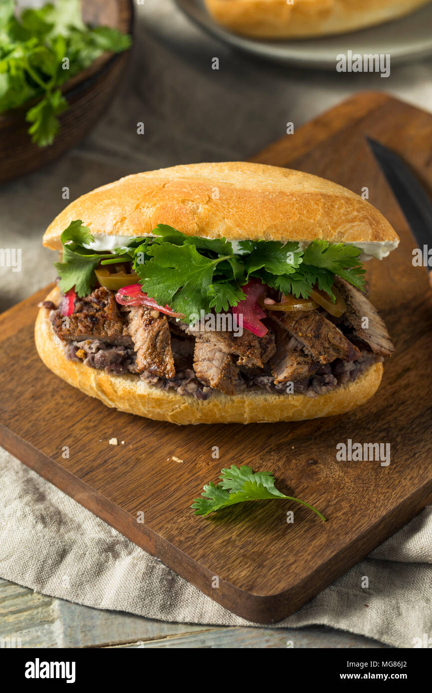 Homemade Mexican Beef Torta Sandwich with Cilantro and Jalapenos Stock ...