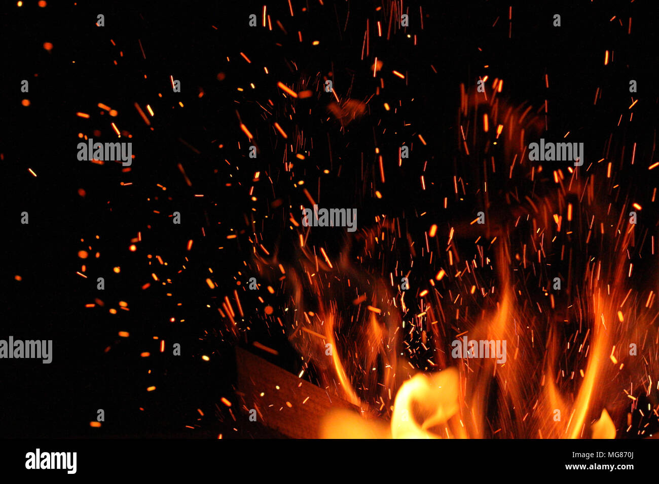 burning bonfire and spark in darc Stock Photo - Alamy