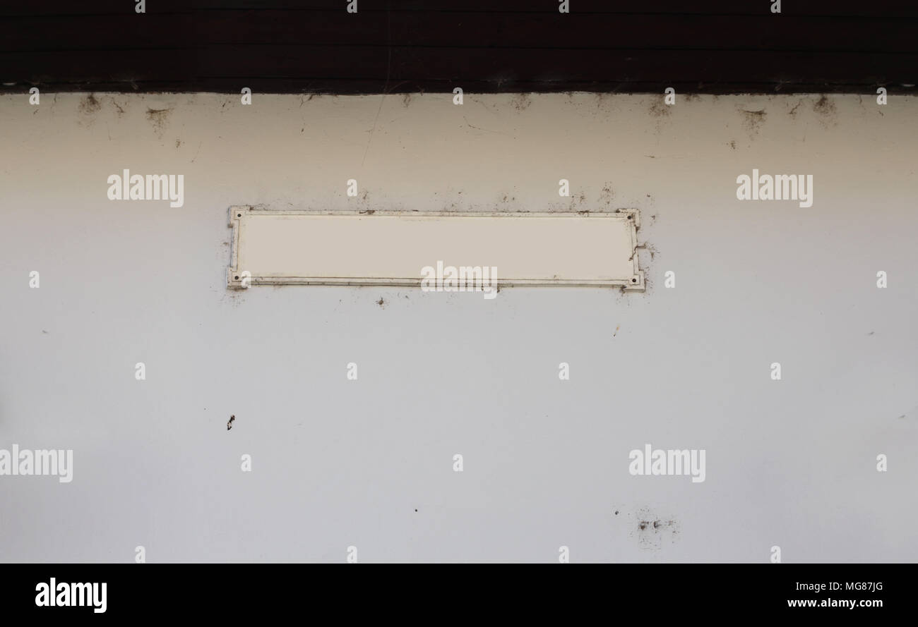 label frame on empty old wall Stock Photo - Alamy