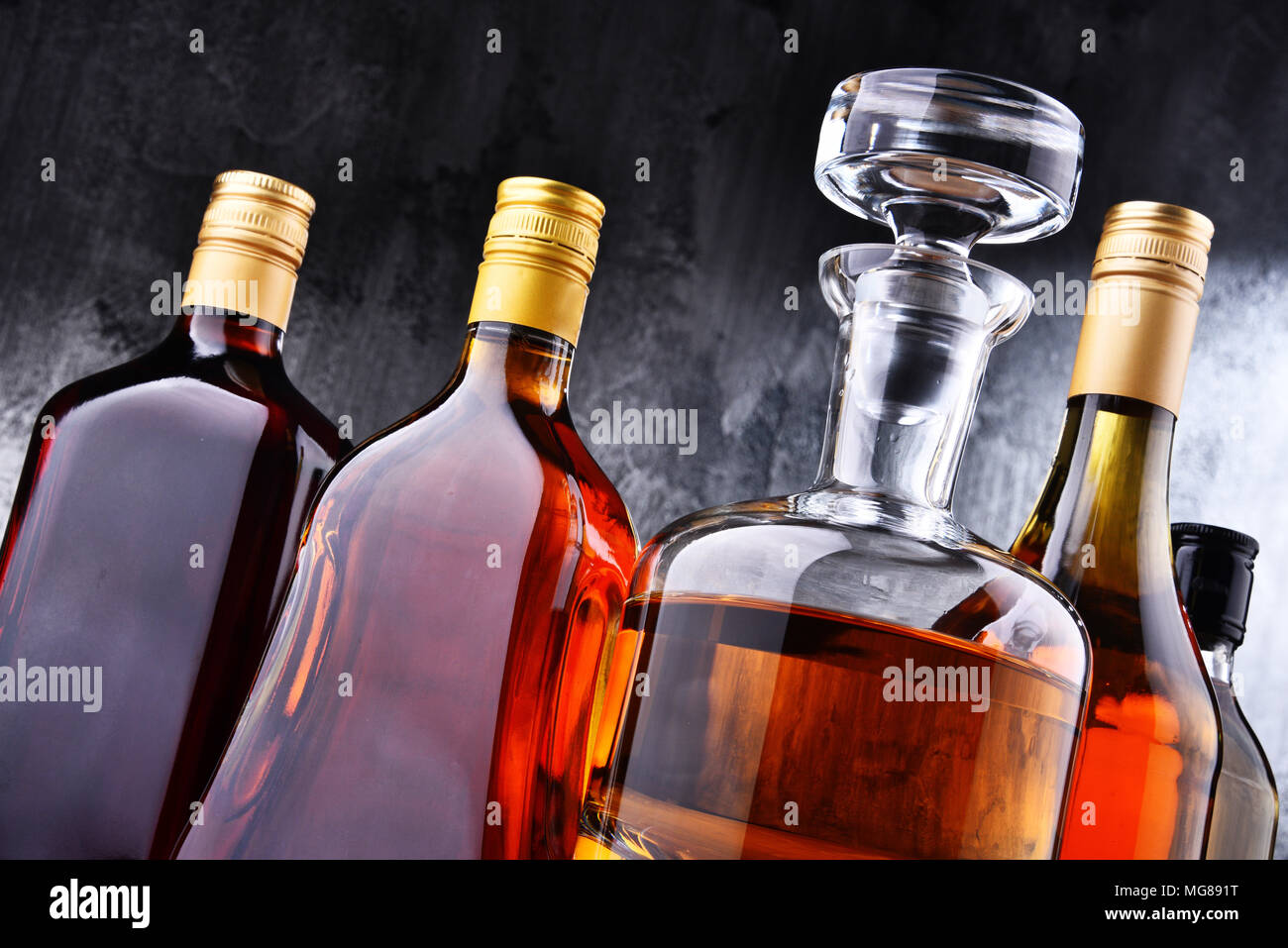 Composition with carafe and bottles of assorted alcoholic beverages ...