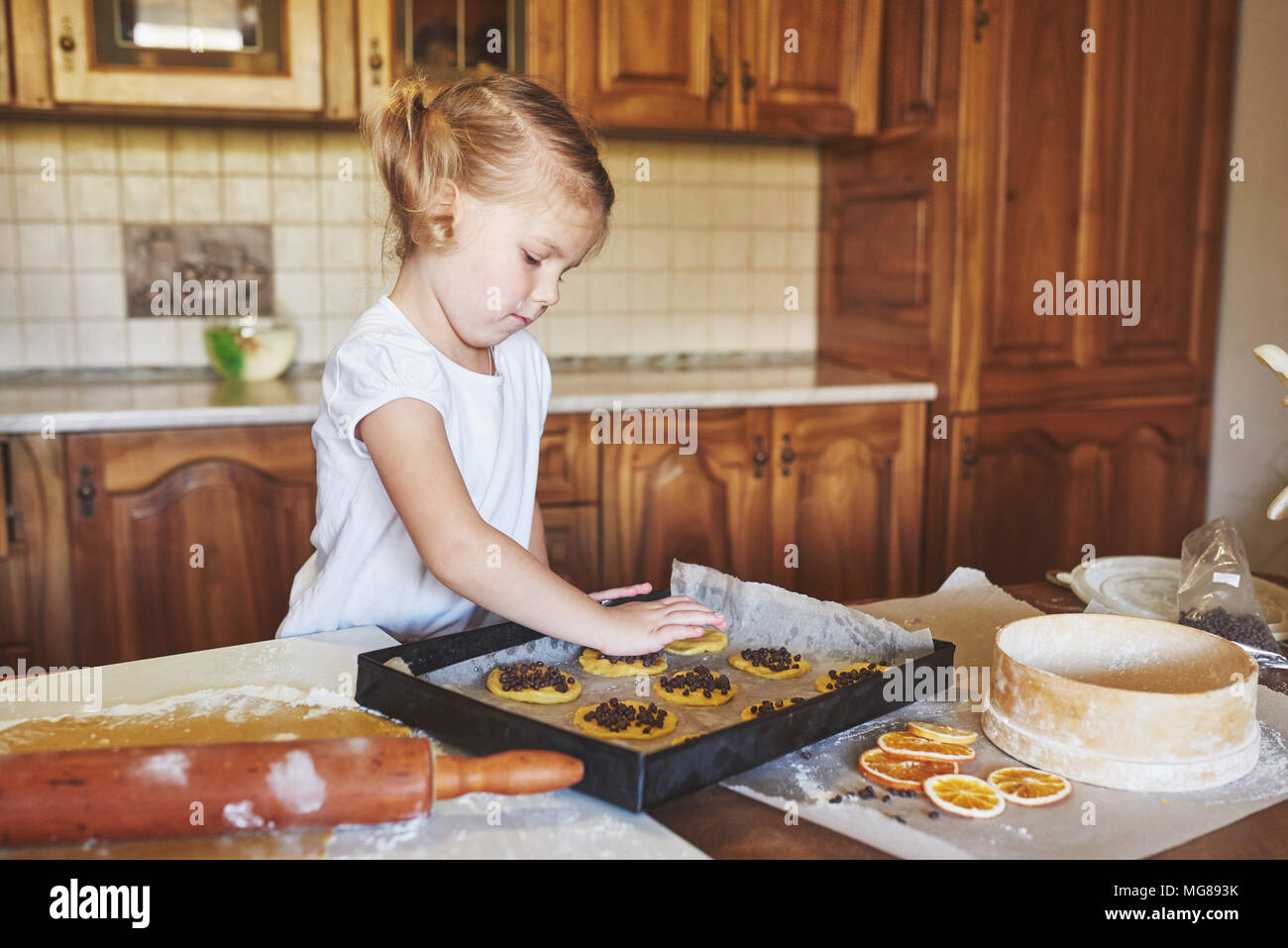 Mom and daughter are busy baking cookies Stock Photo - Alamy