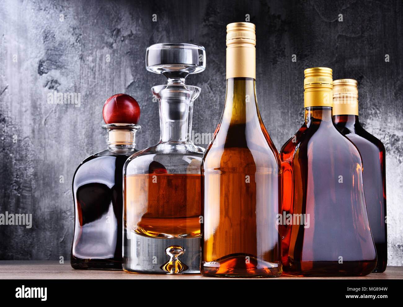 Composition with carafe and bottles of assorted alcoholic beverages ...